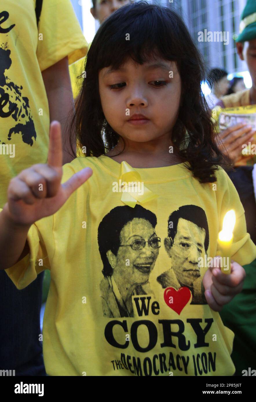 A little girl flashes the "L" sign for Laban, or Fight, while holding a ...