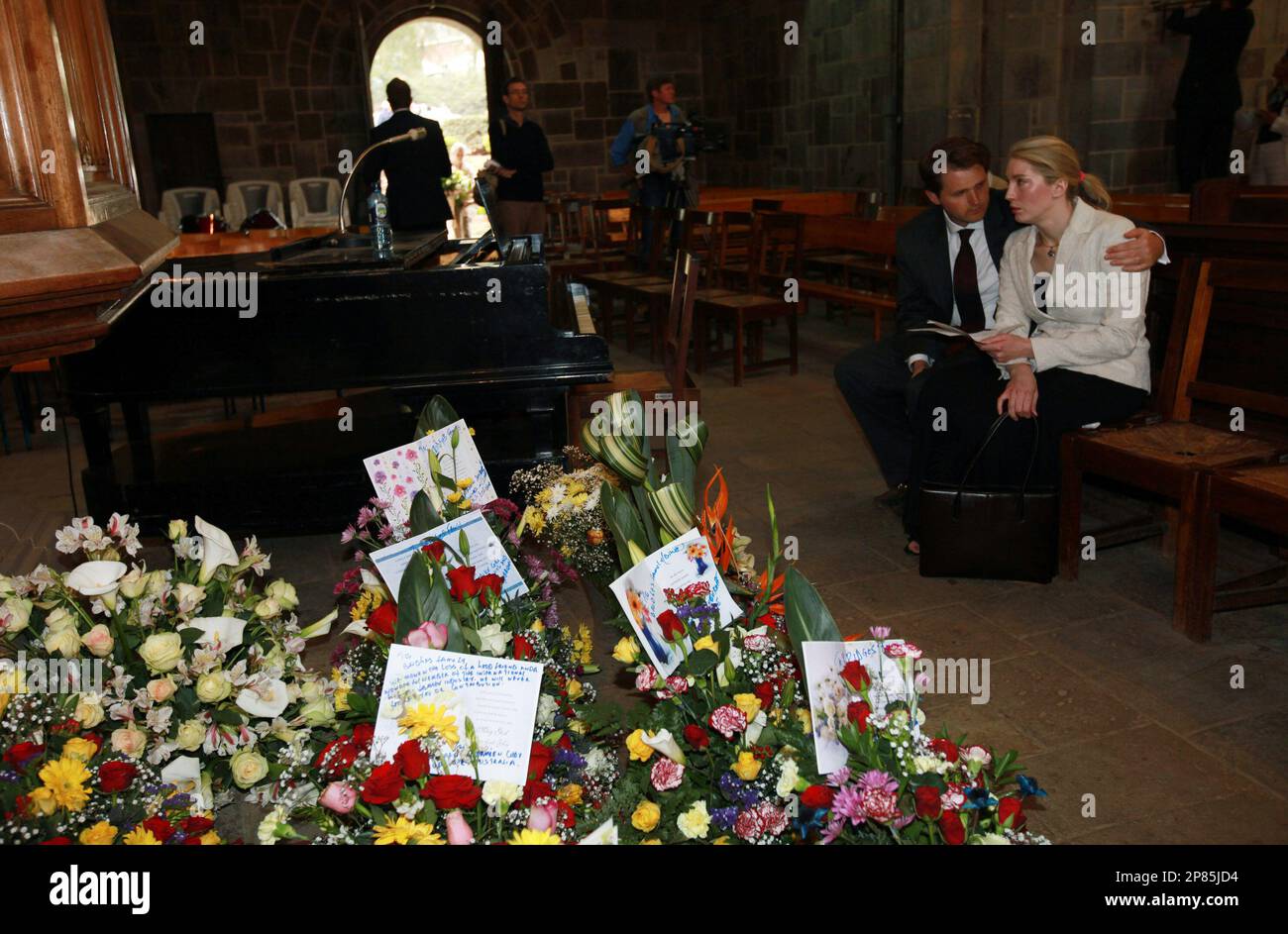 A friend console Laura Bridges, daughter of Campbell Rodney Bridges ...