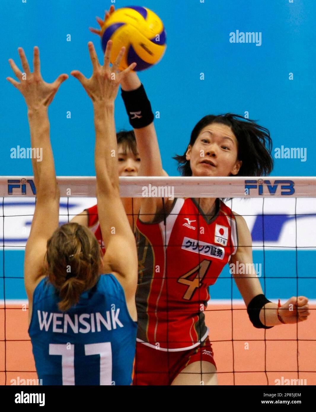 Japan's Kaori Inoue, right, spikes the ball against Netherlands ...