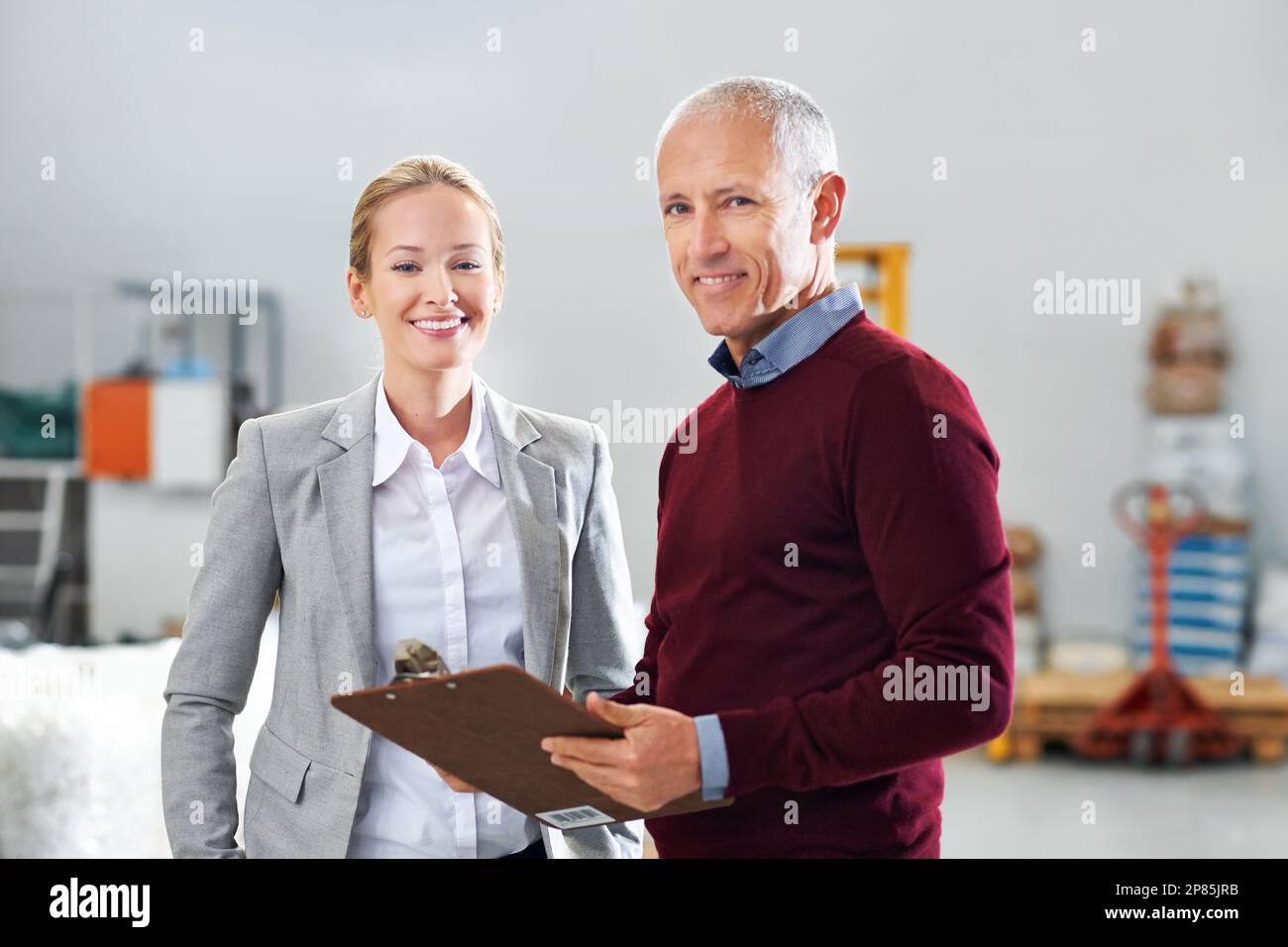 Assuring quality on the shop floor. Portrait of two factory managers ...