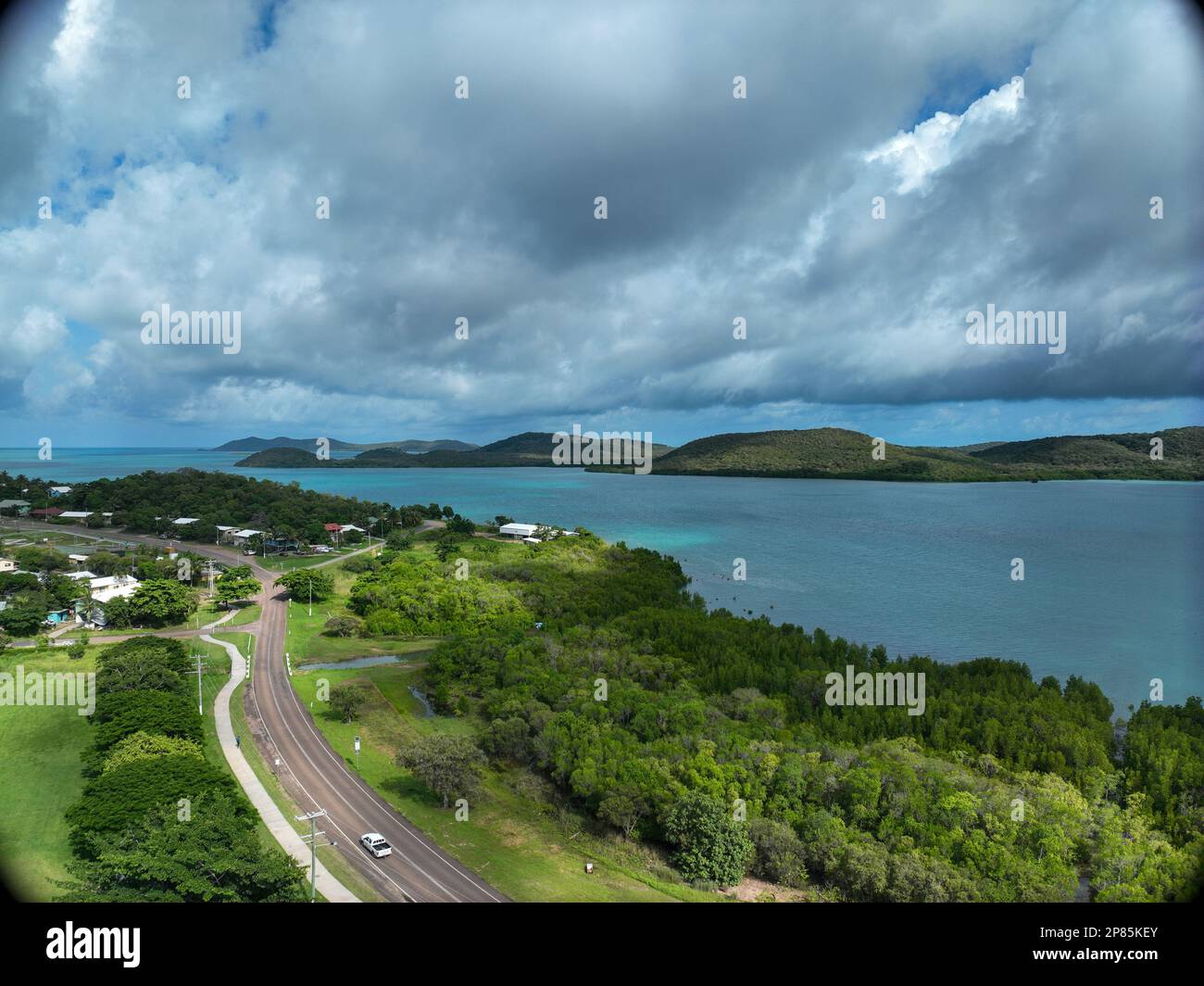 Aerial view of a road along side the ocean on a tropical island Stock ...