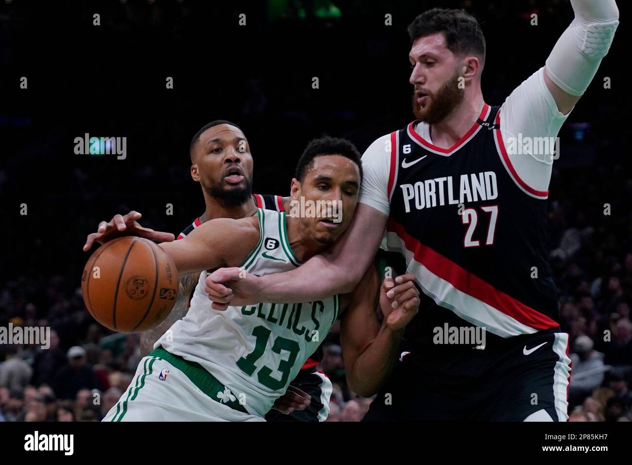 Boston Celtics guard Malcolm Brogdon (13) is pressured by Portland ...