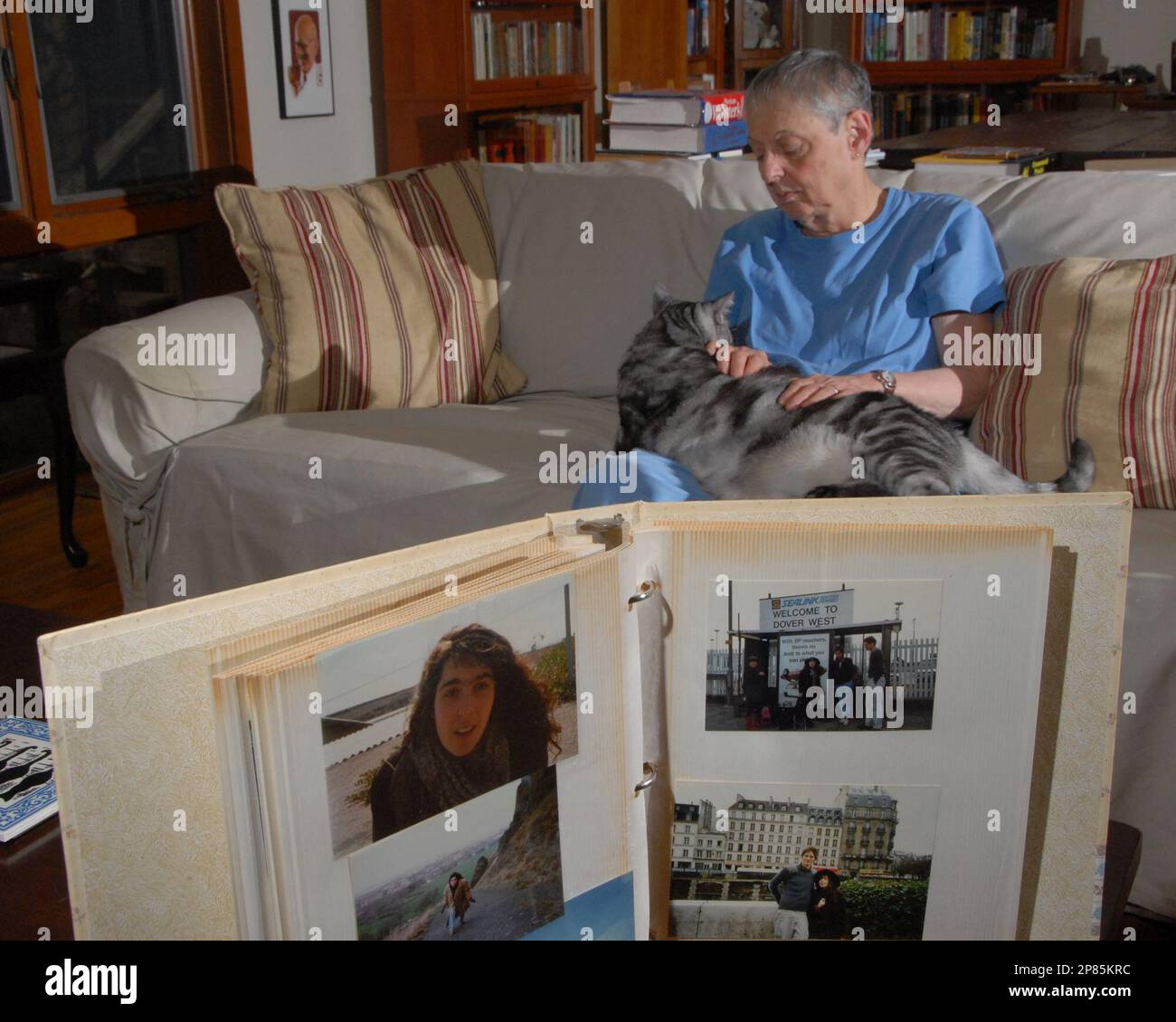 Susan Cohen sits with Archie, one of her cats, in her home in Cape May ...
