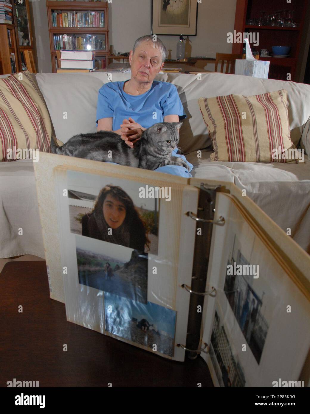 Susan Cohen sits with Archie, one of her cats, in her home in Cape May ...