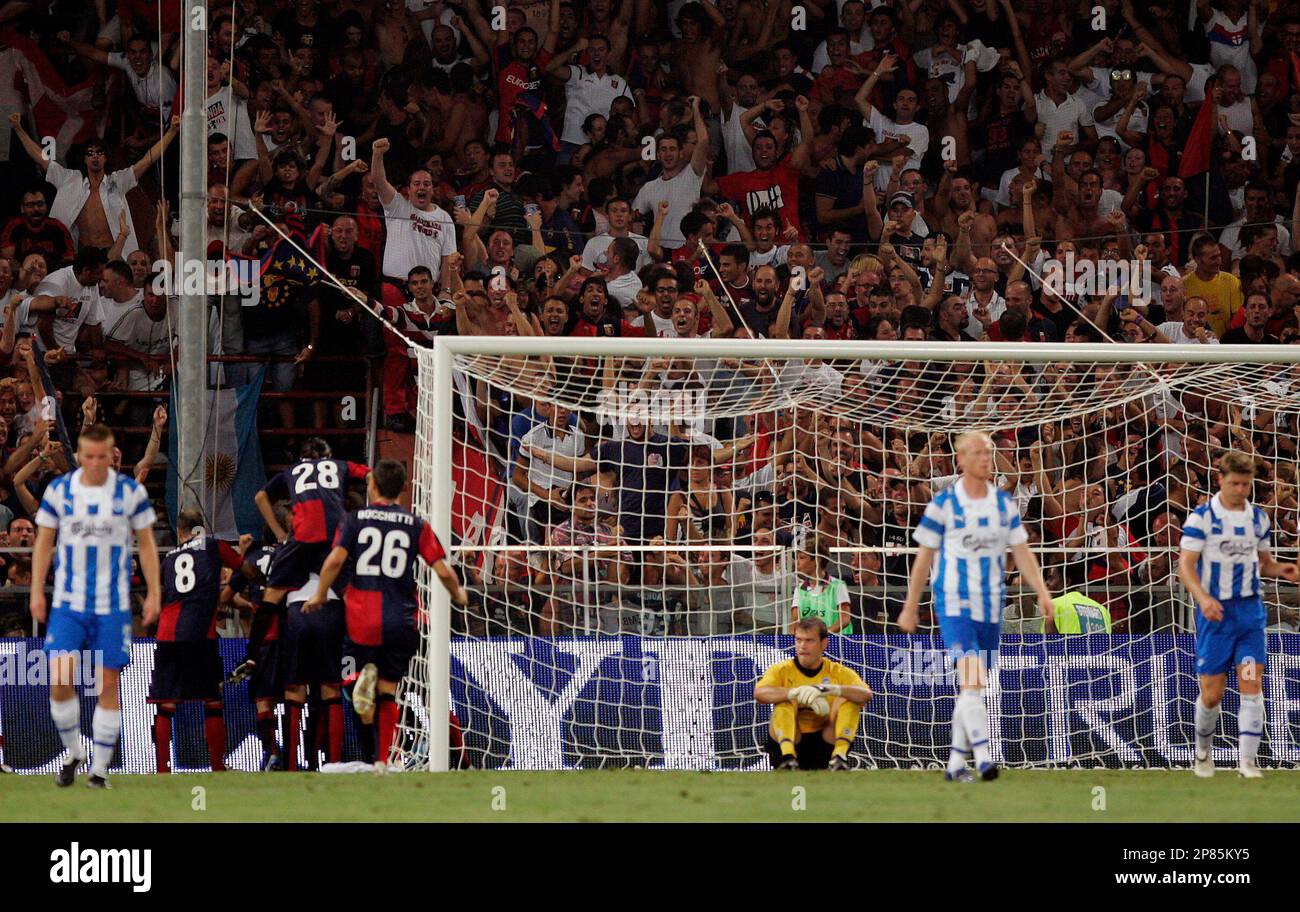 Genoa's players, background left, celebrate the score during the Europa ...