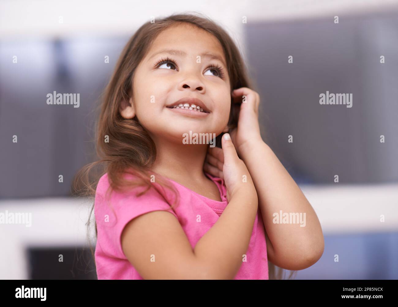 Shes got a great imagination. a cute little girl at home Stock Photo ...
