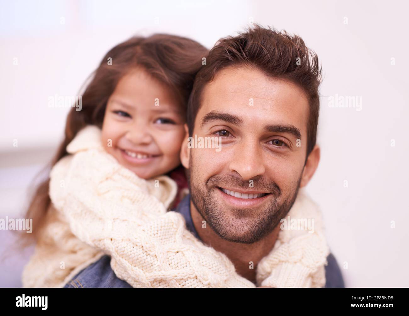 Carrying his greatest treasure on his back. Portrait of a cute little ...