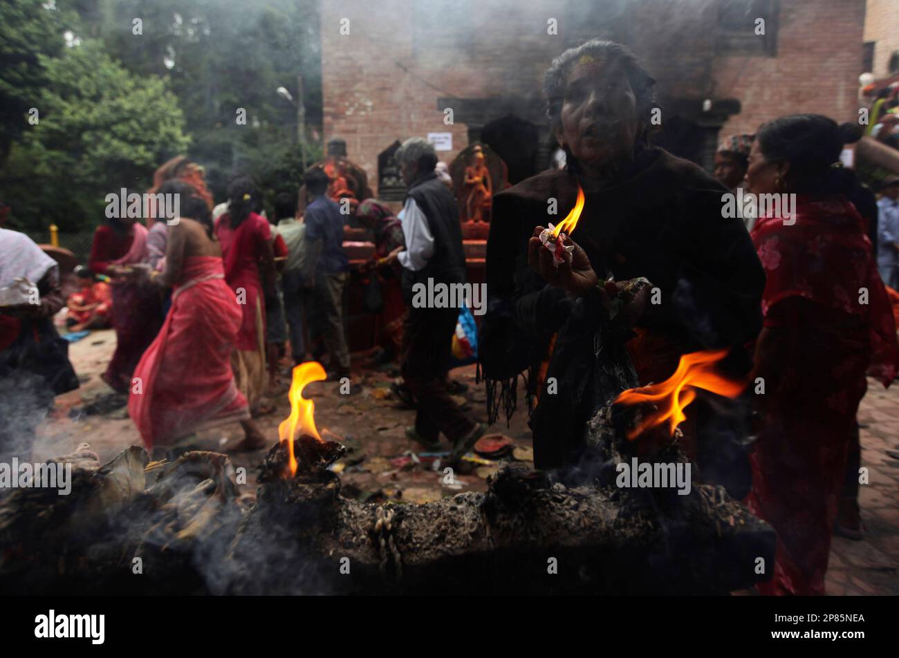 Hindu devotees perform rituals during "Gokarna Aunsi" at Gokarneshwar ...