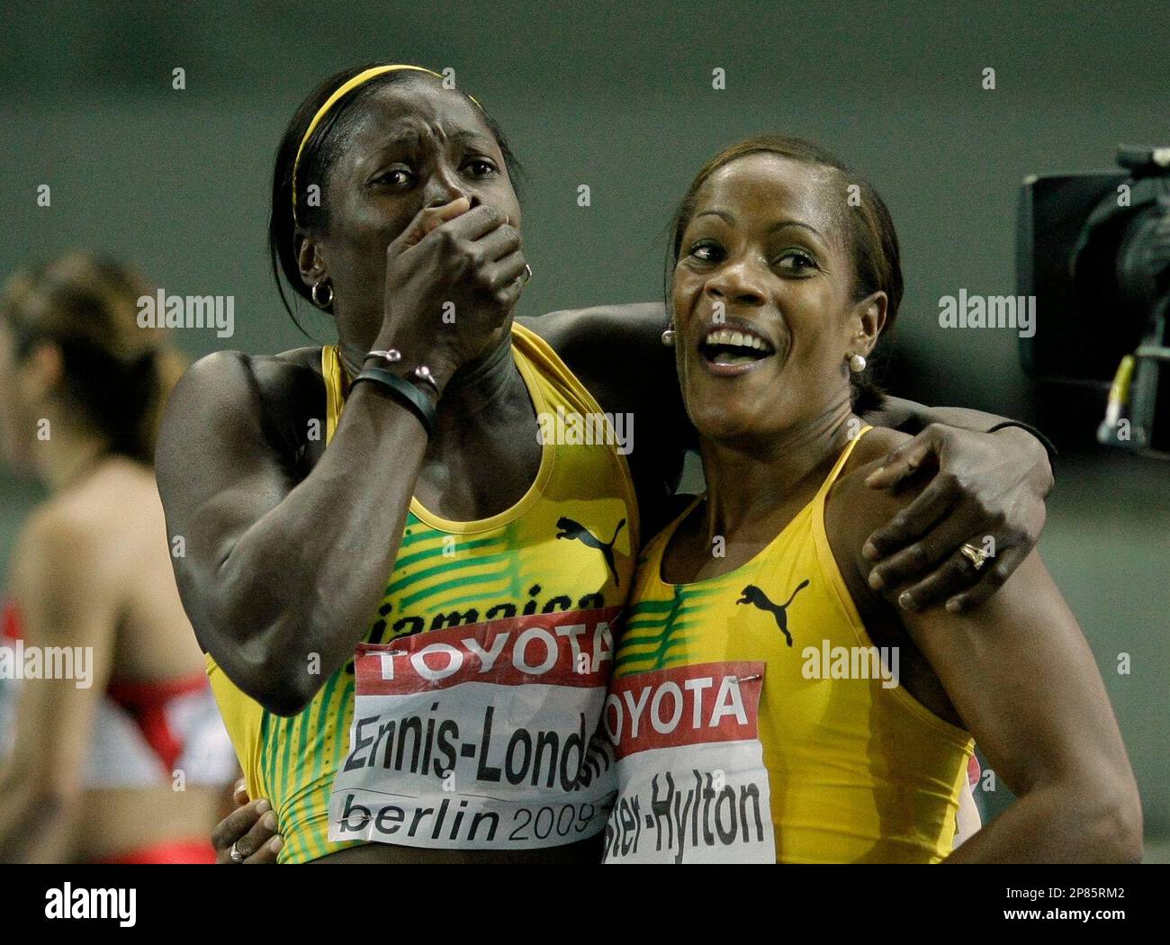 Jamaica's Brigitte Foster-Hylton, right, reacts after winning the gold ...