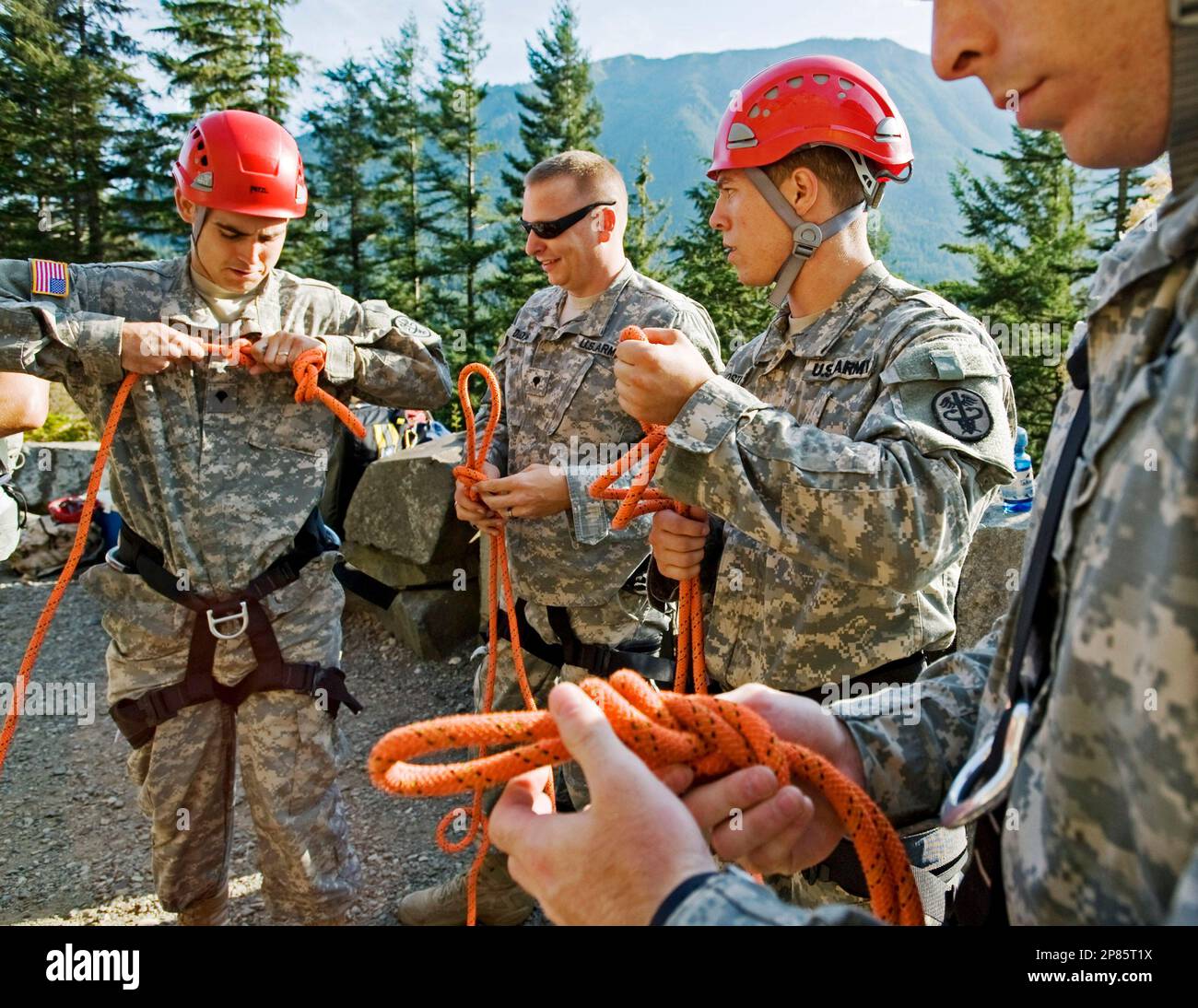 Soldier medics learn the "figure eight knot" for tying themselves to a ...