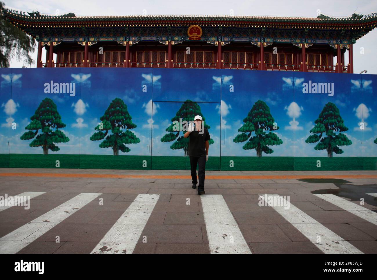 A plainclothes security guard stands outside of Zhongnanhai, China's ...