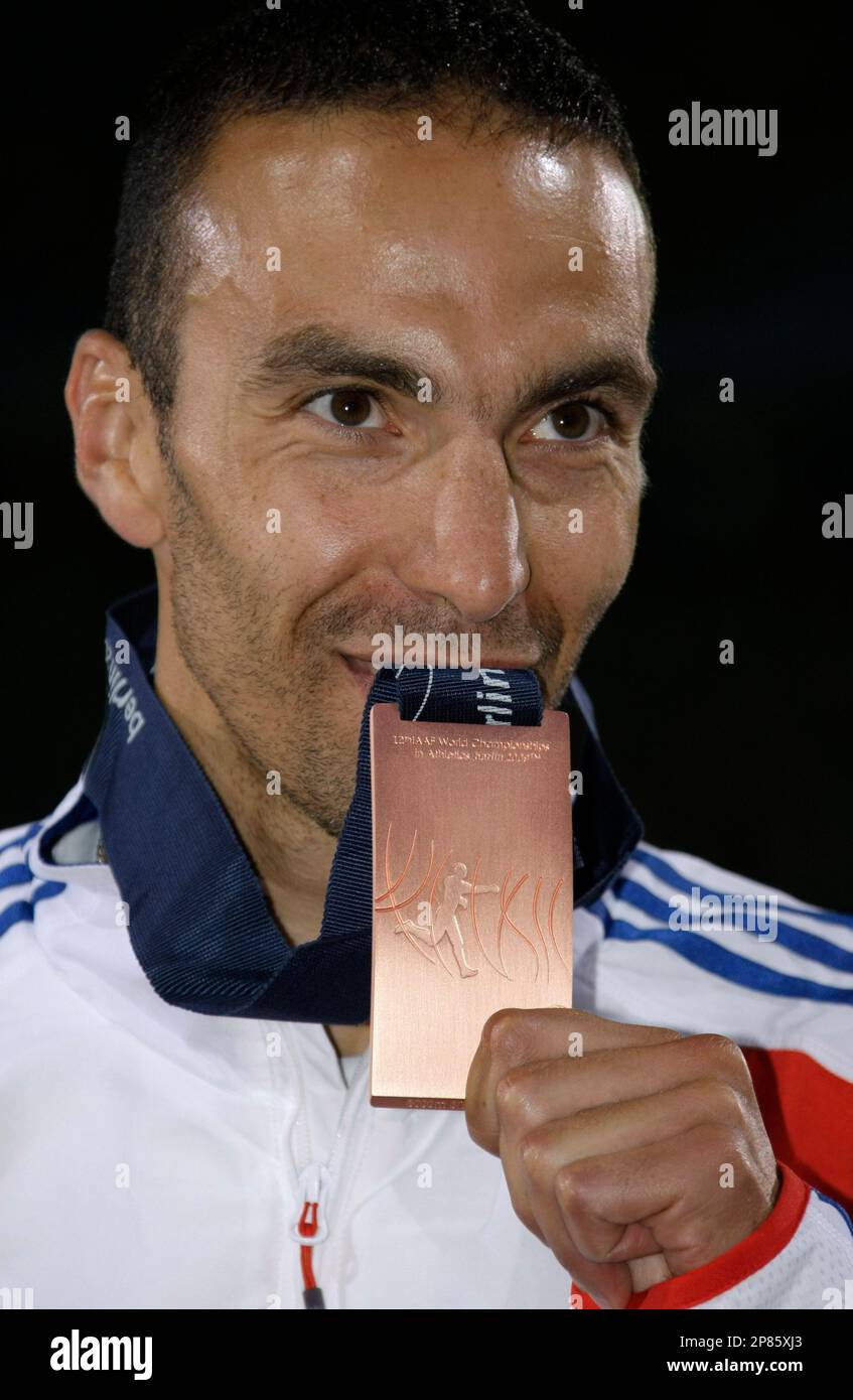 France's Bouabdellah Tahri kisses his bronze medal after the ceremony ...
