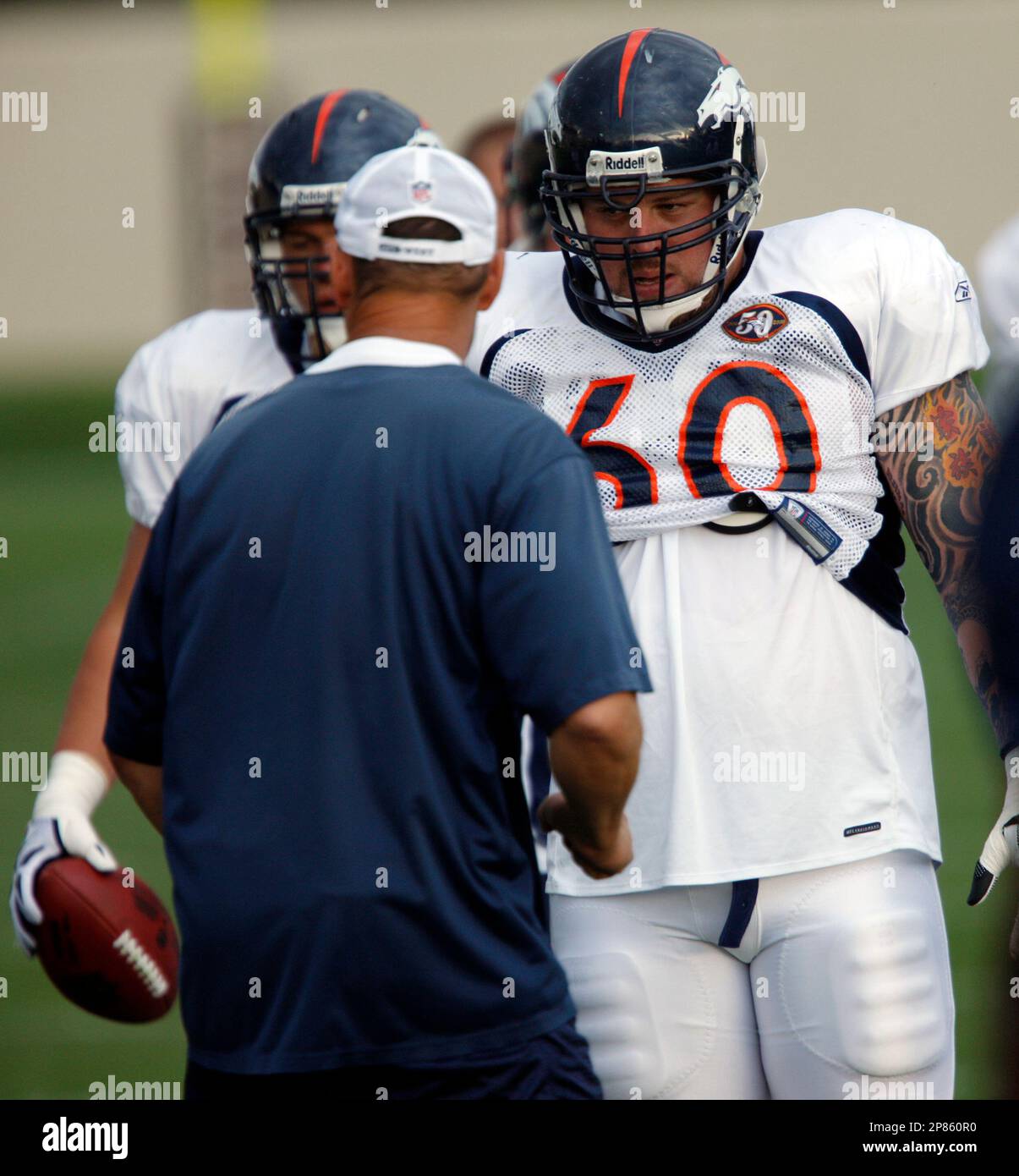 Denver Broncos guard Matt McChesney (60) listens to offensive line ...