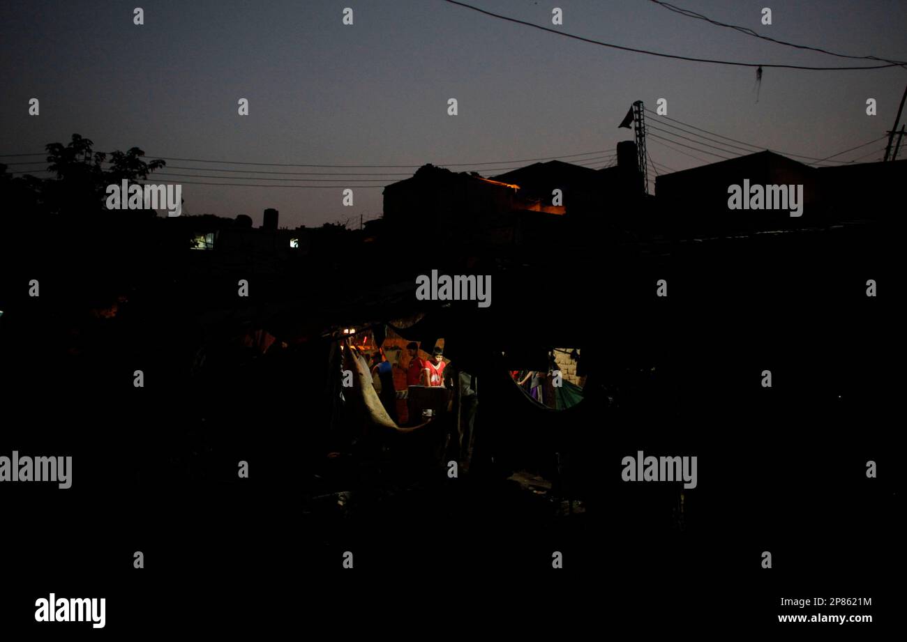 Pakistani boys play table soccer, in a Christian colony in Islamabad ...