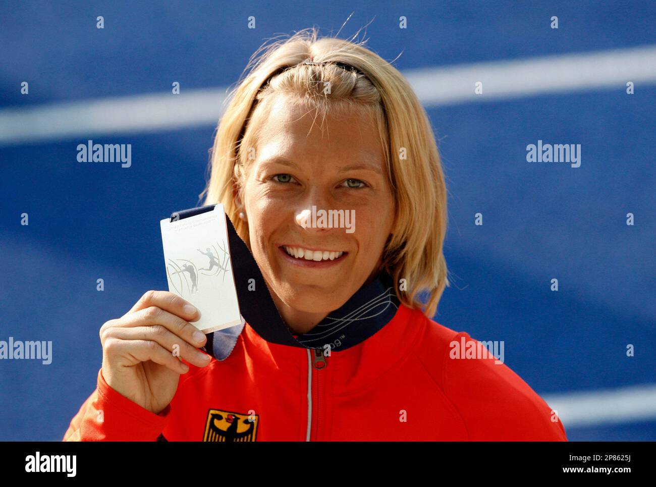Germany's Jennifer Oeser smiles as she holds her silver medal after the ...