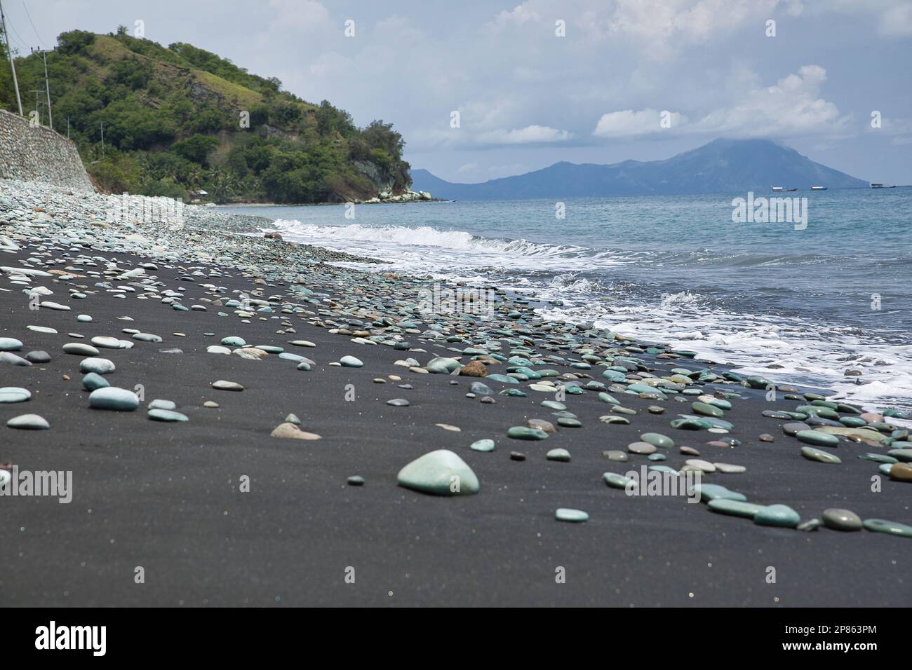 Close-up of blue stones on the beach of Pantai Batu Biru, the Blue ...