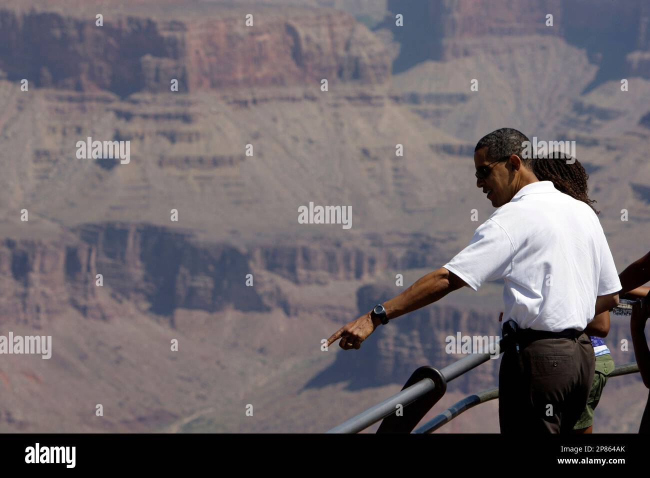 President Barack Obama and his family look out over Hopi Point as they ...