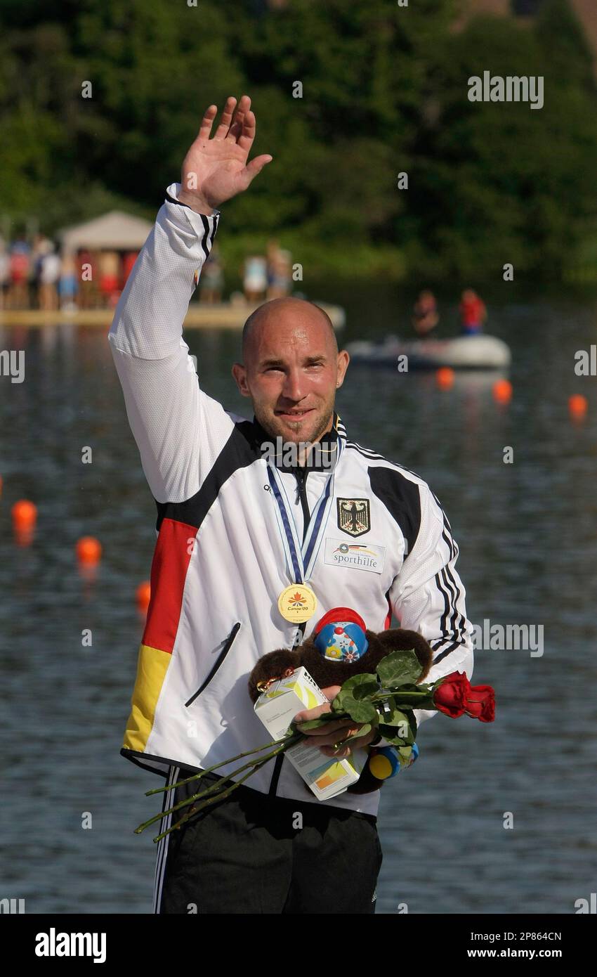 Germany's Ronald Rauhe waves to the crowd after receiving his gold ...