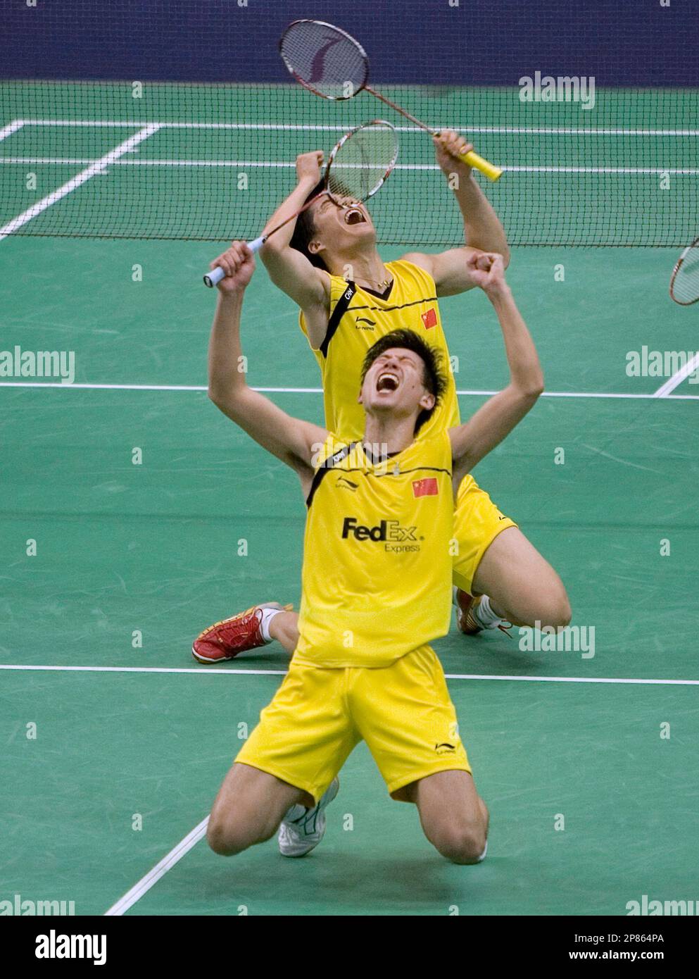 China's Cai Yun, front and Fu Haifeng react after winning the men's ...