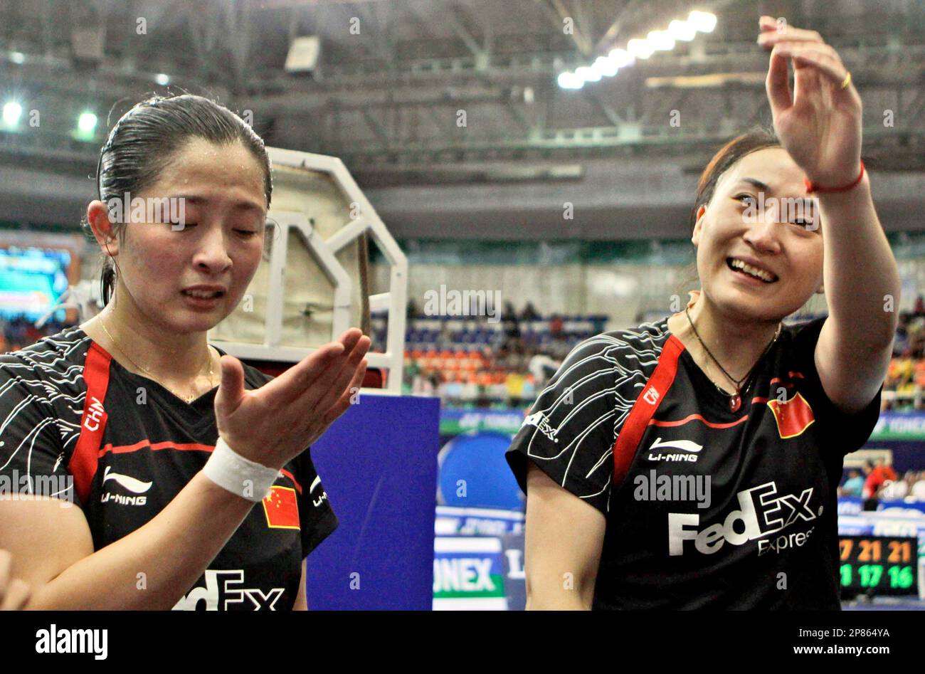 China's Zhao Tingting, right, and Zhang Yawen react after winning the ...
