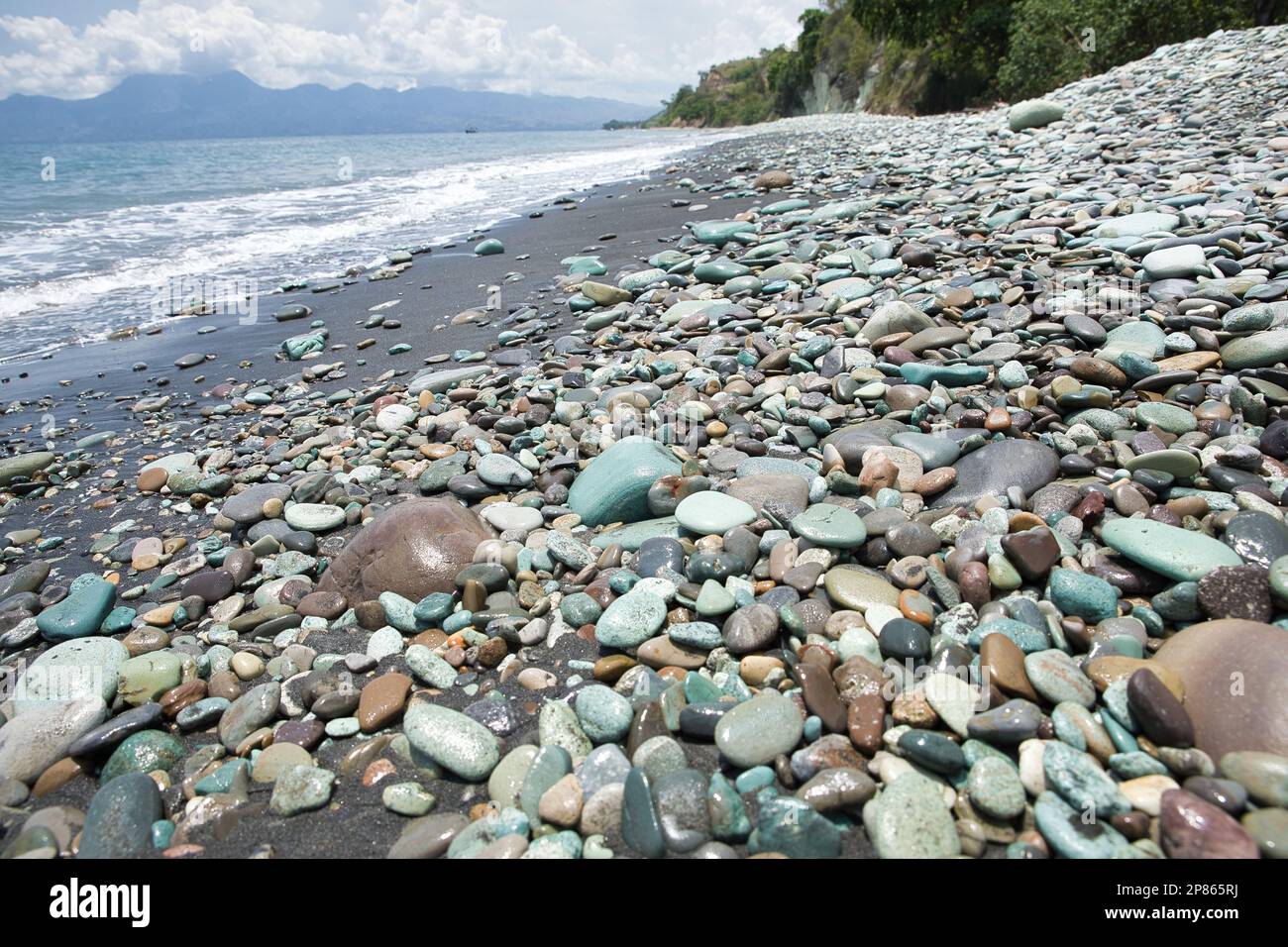 Close-up of blue stones on the beach of Pantai Batu Biru, the Blue ...