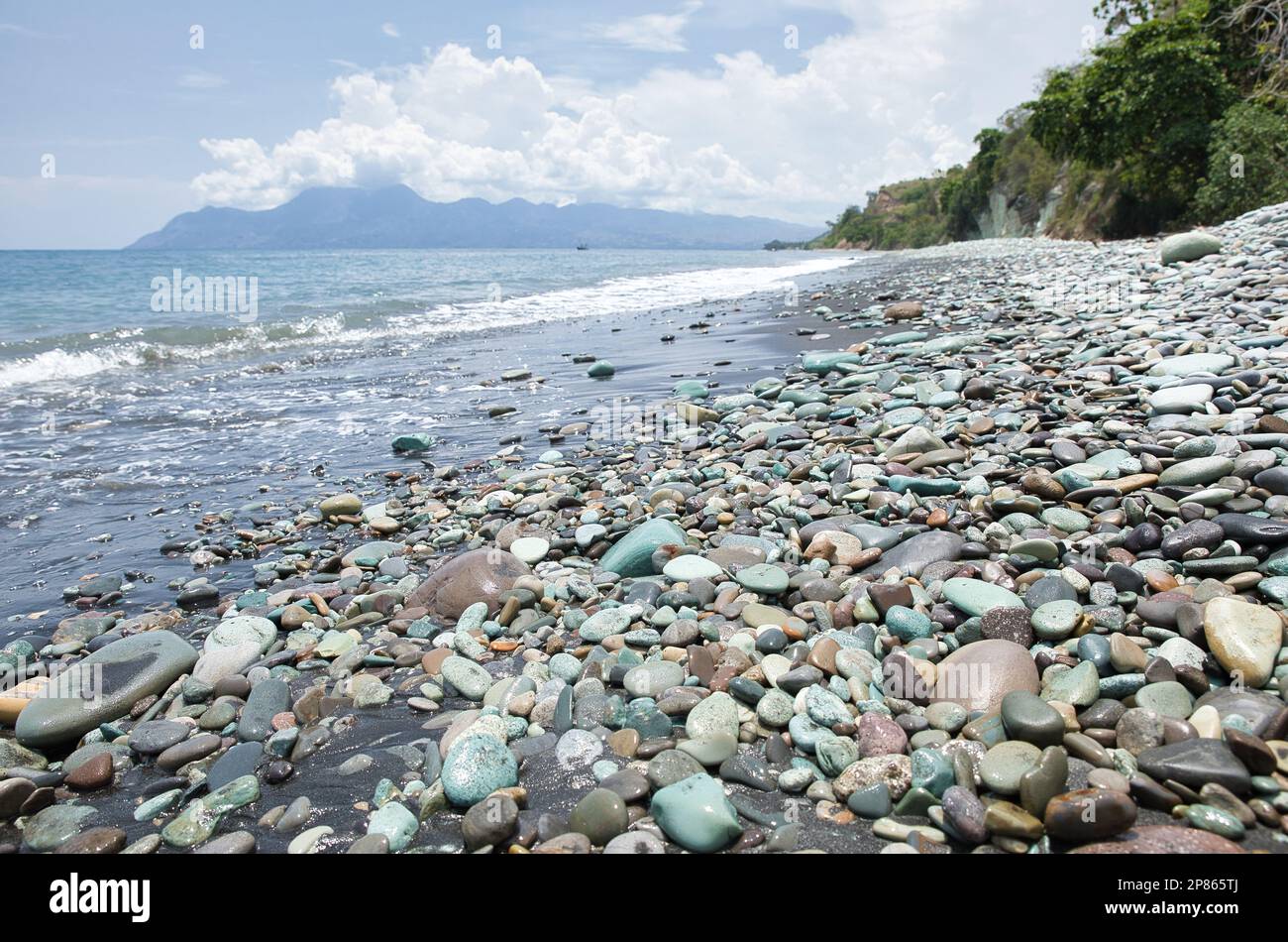 Close-up of blue stones on the beach of Pantai Batu Biru, the Blue ...
