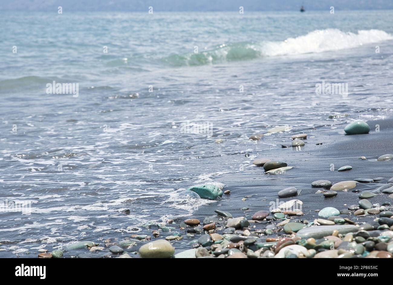 Close-up of blue stones on the beach of Pantai Batu Biru, the Blue ...