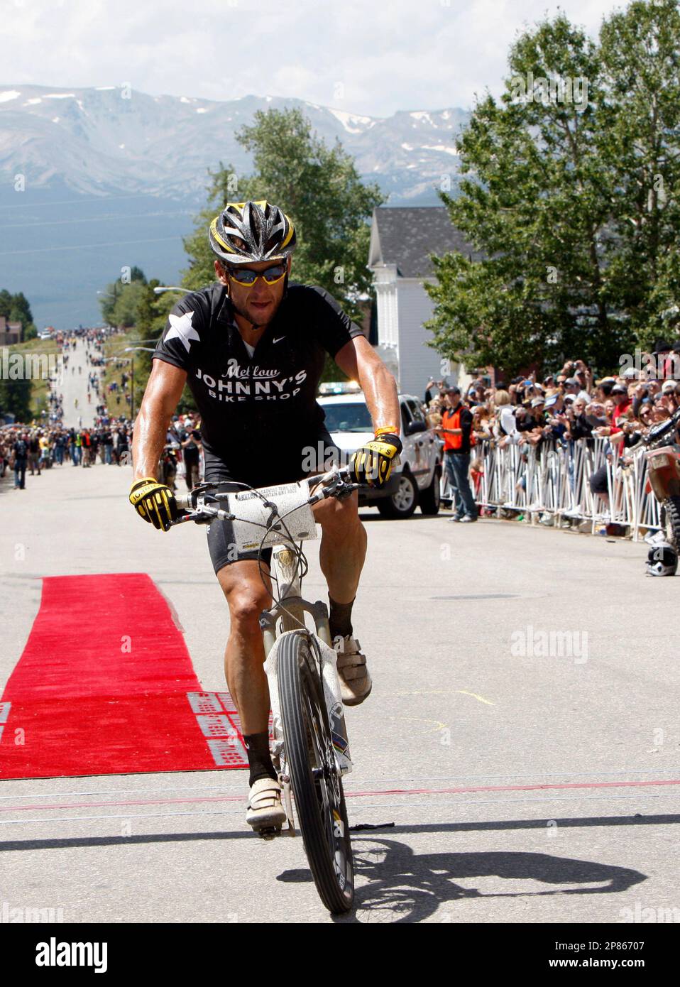 Lance Armstrong of Aspen, Colo., crosses the finish line to win the ...