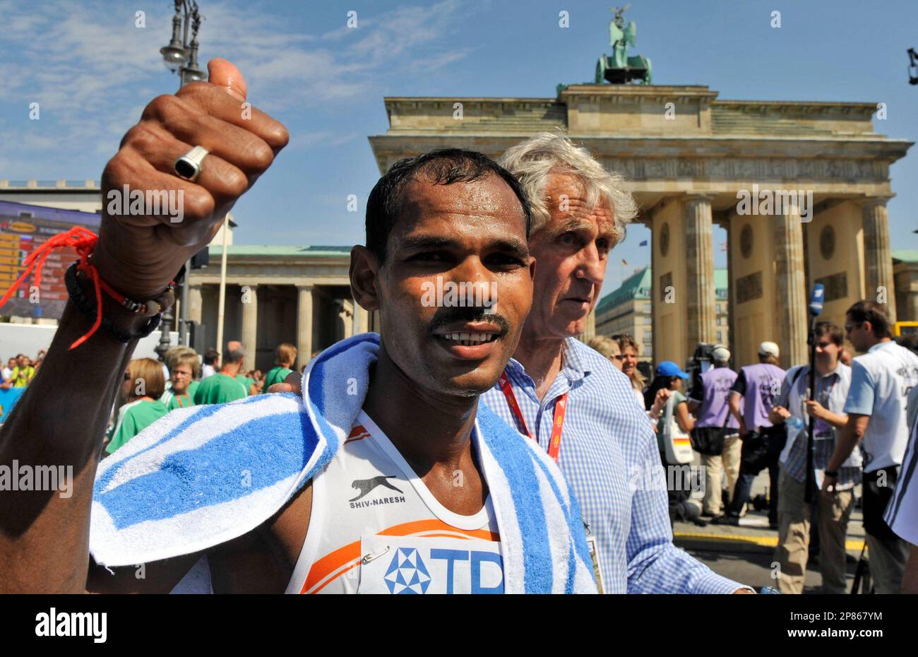 India's Panucha Babubhai reacts after finishing the Men's 20km race ...