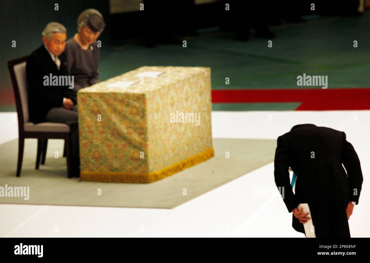 Japan's Prime Minister Taro Aso, right, bows to Emperor Akihito and ...