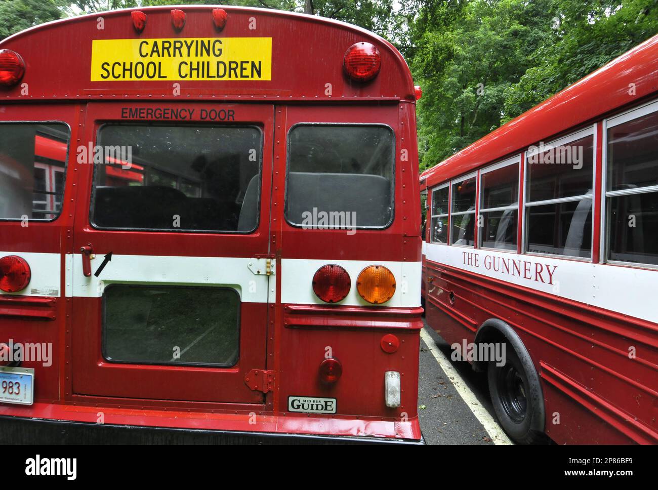 School buses for The Gunnery school are lined up on campus in ...