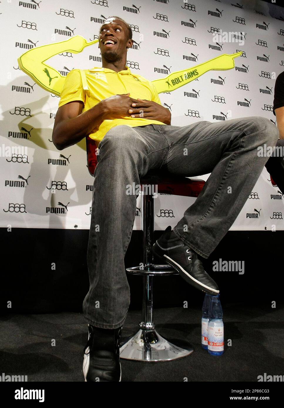 Jamaican sprinter Usain Bolt poses for photographs with a pair of 'Bolt ...