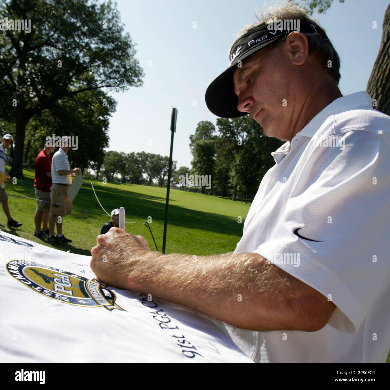 Michael Miles signs an autograph during a practice round for the 91st ...