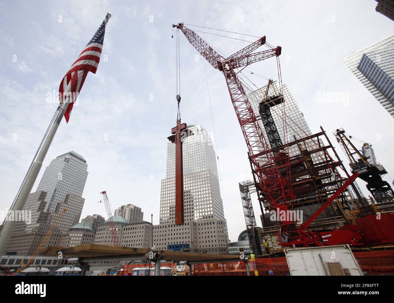 A 70-ton perimeter column for One World Trade Center is lowered into ...