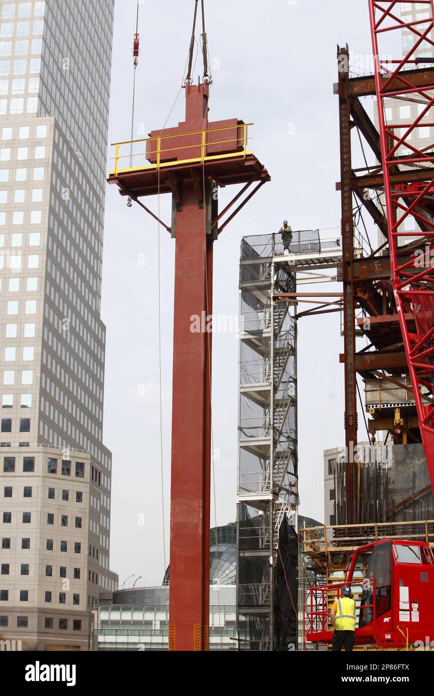 A 70-ton perimeter column for One World Trade Center is lowered into ...