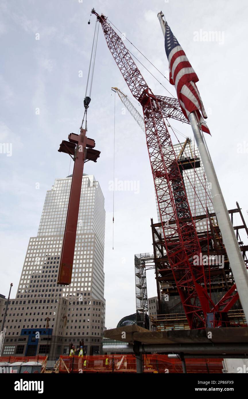 A 70-ton perimeter column for One World Trade Center is lowered into ...