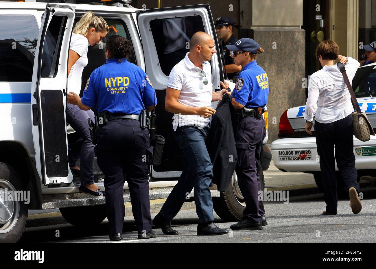 Mourners arrive in New York City police vehicles at the Frank E ...