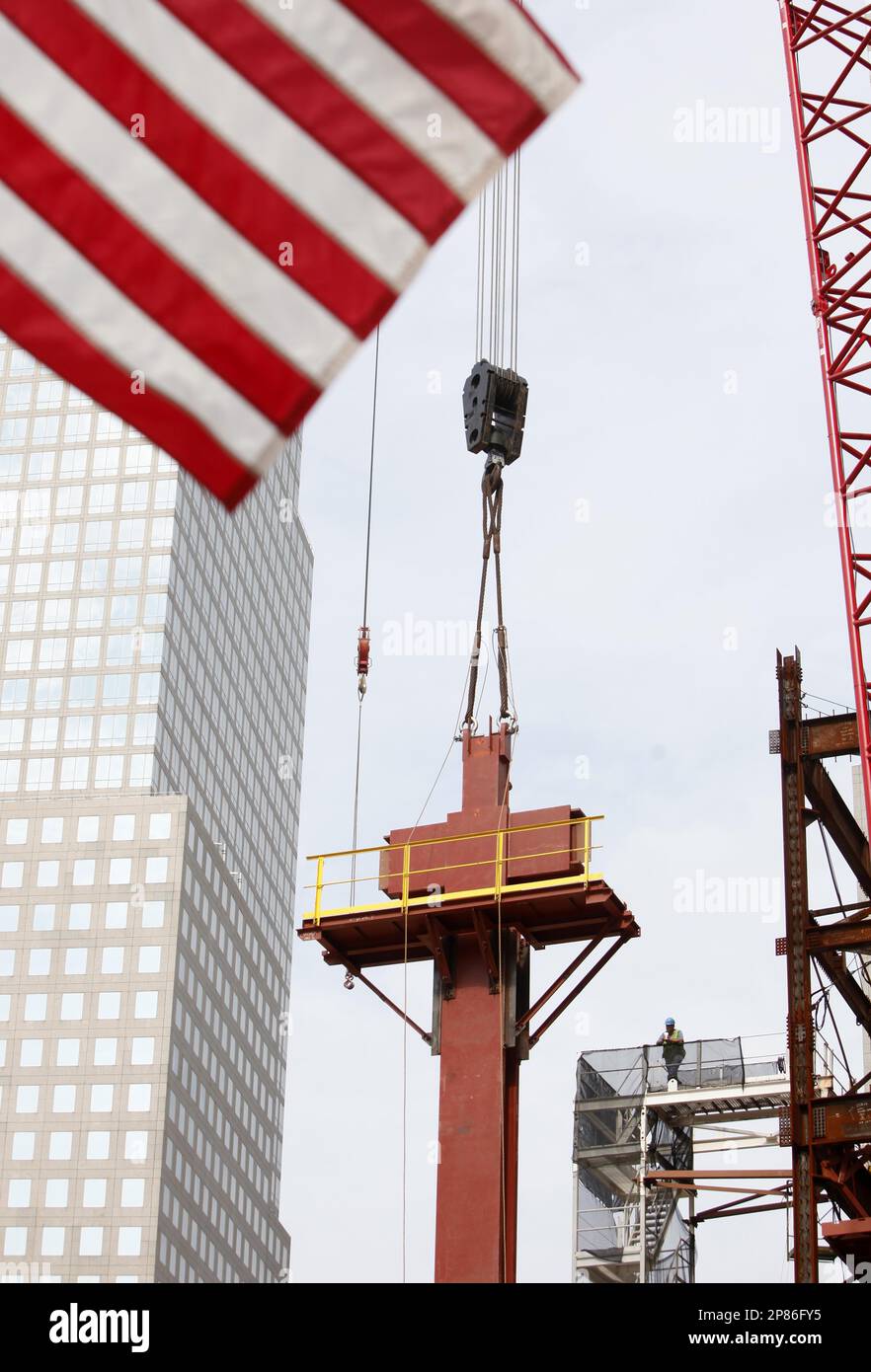 A 70-ton perimeter column for One World Trade Center is lowered into ...