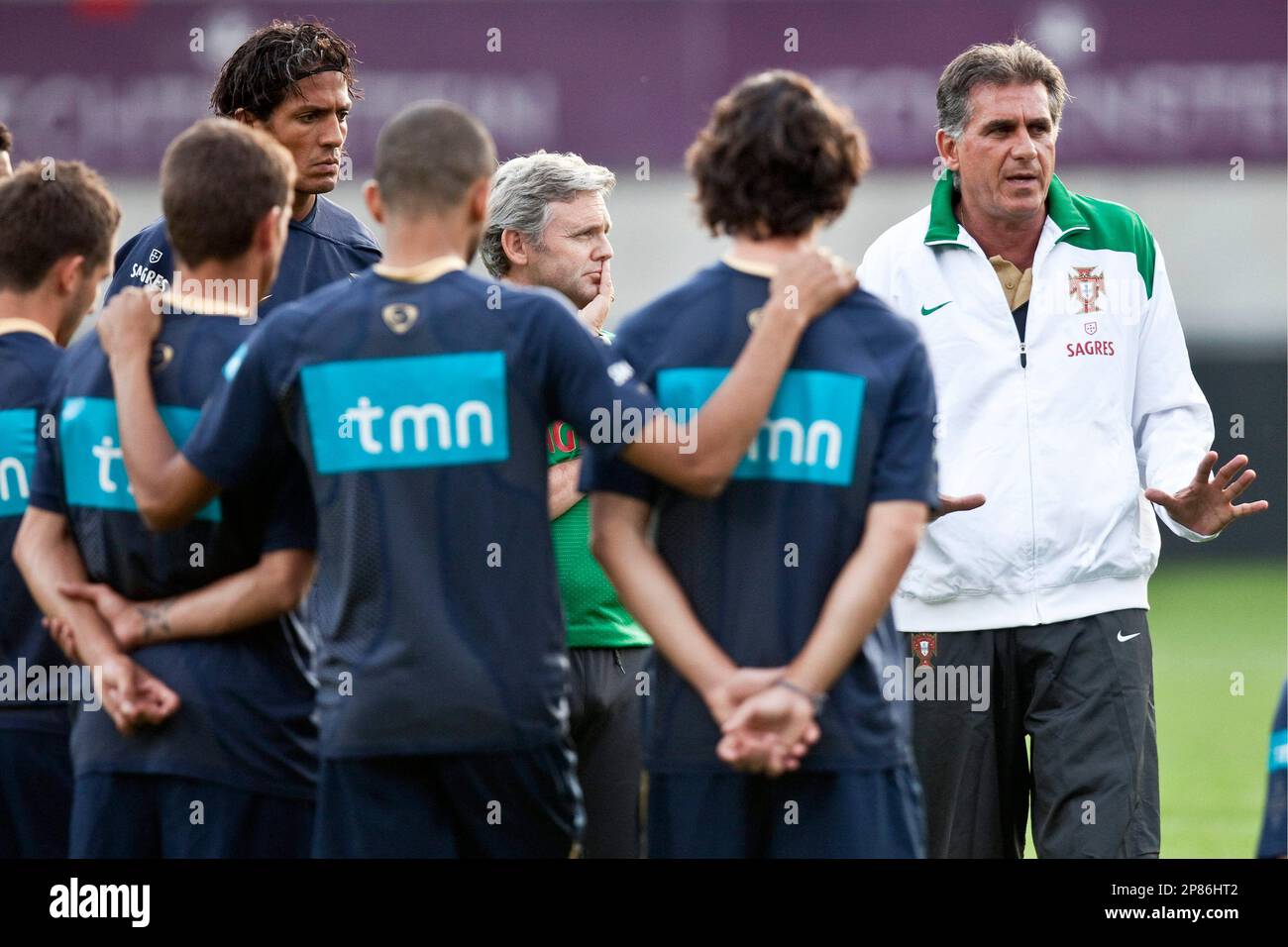 Portugal's national soccer team coach, Carlos Queiroz, right, speaks to ...