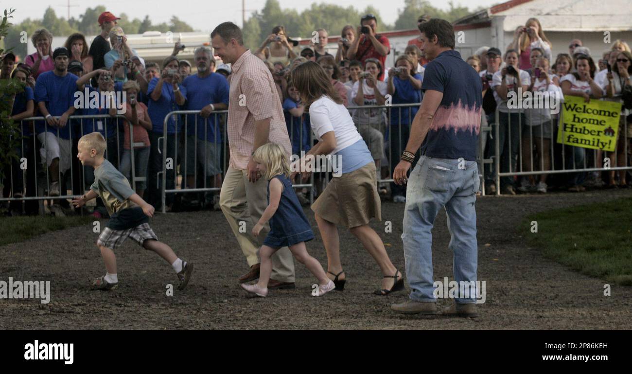 The Huber Family runs into their newly built house in South Range, Wis ...