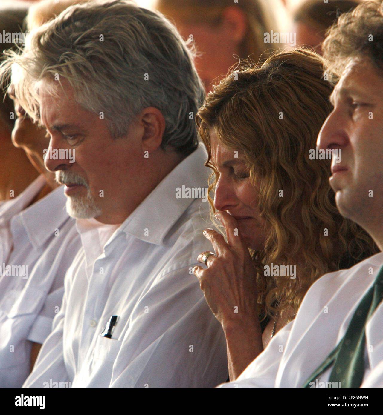 Gregory Burk, left, and his wife, Deborah Drooz, mourn the loss of ...