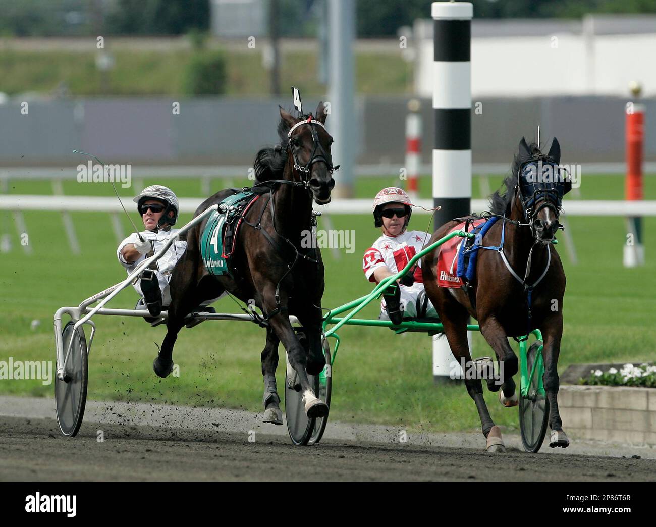 Broadway Schooner, left driven by Brian Sears is ahead of Elusive ...