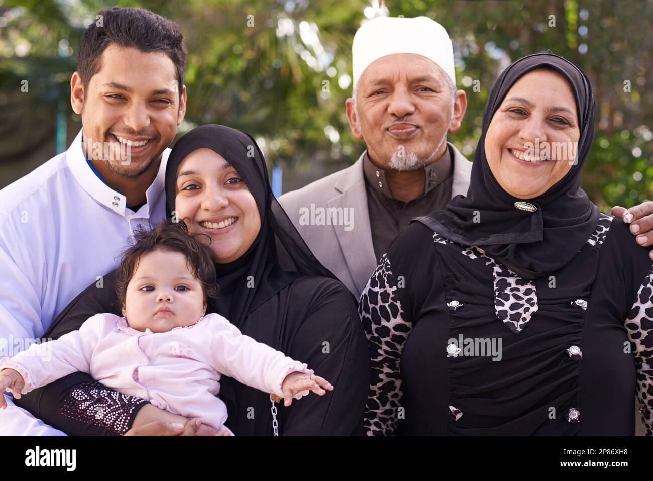 Generations of joy. Portrait of a muslim family enjoying a day outside ...