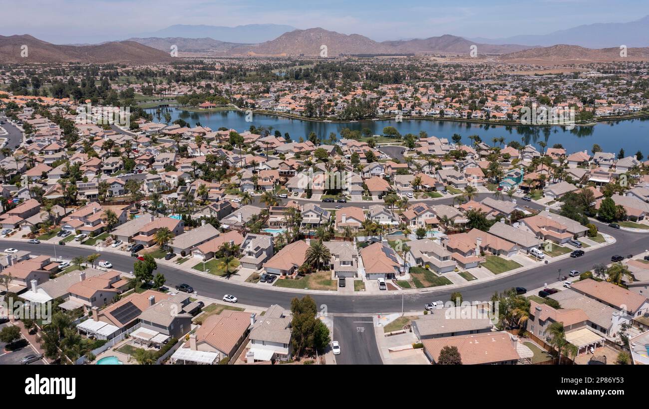Aerial view of sprawling single family home neighborhood and lake of ...