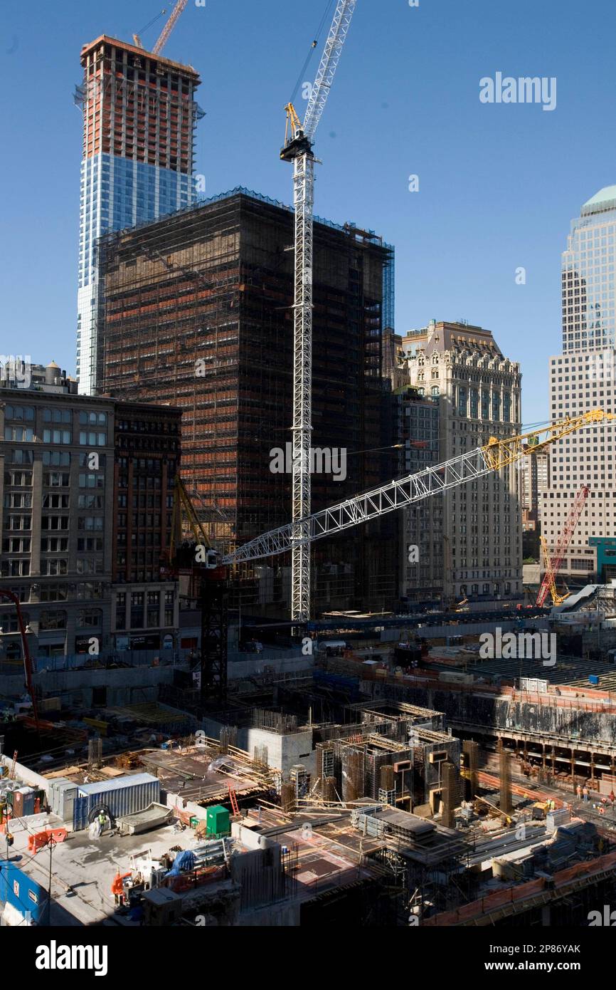 Cranes work on the construction site of Tower 4, bottom, at the World ...