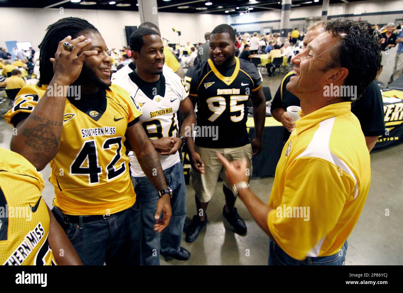 Southern Mississippi football coach Larry Fedora, right, jokes with ...
