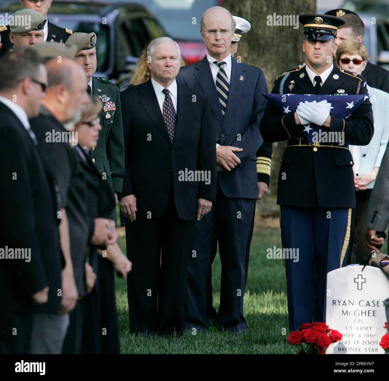 Defense Secretary Robert Gates, center, left, and Army Secretary Pete ...