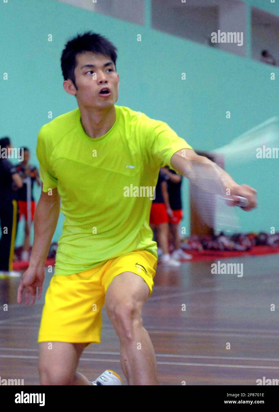 China's badminton player Lin Dan hits a shot during a practice session ...