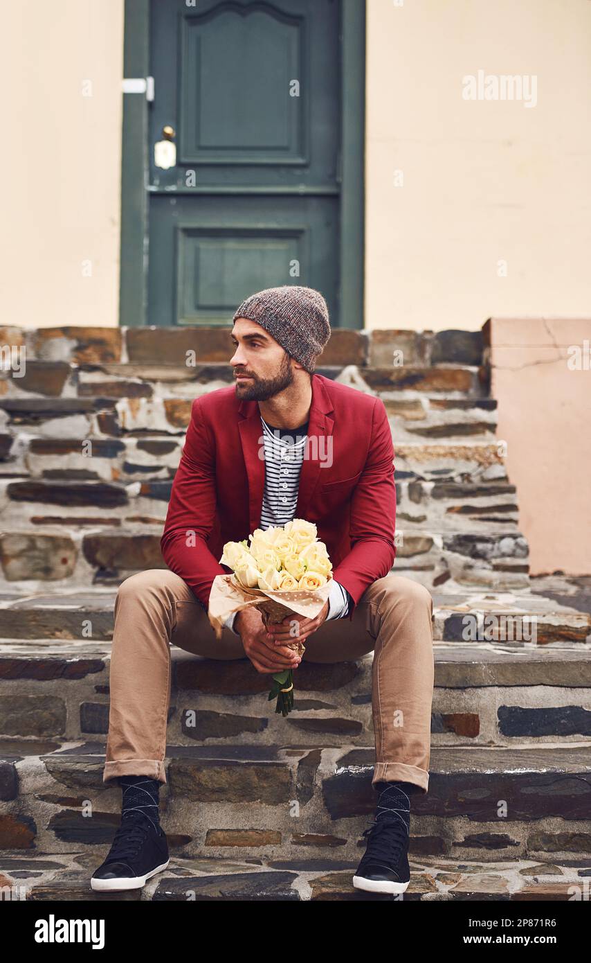 Young man waiting bunch flowers hi-res stock photography and images - Alamy