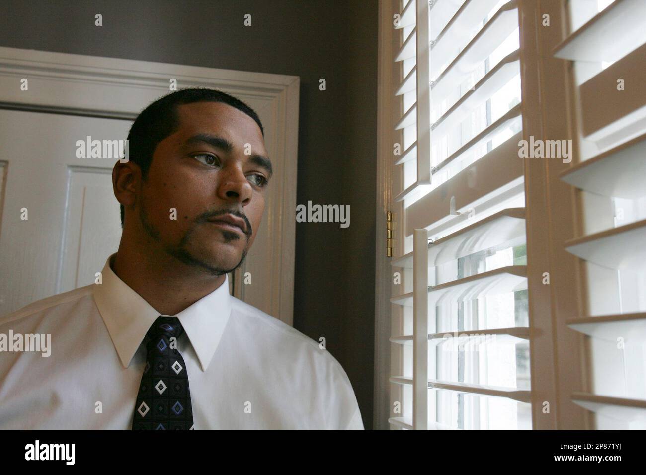 Justin Mallory looks out the window at his attorney's office Tuesday ...